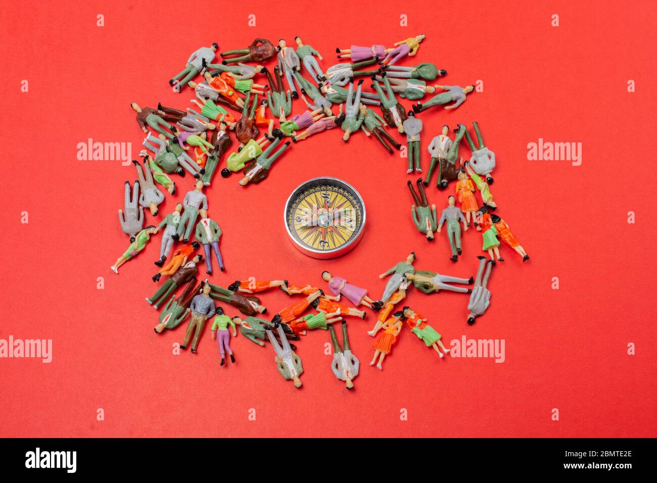 Colorful diverse miniature people figurines make crowd on ground Stock ...