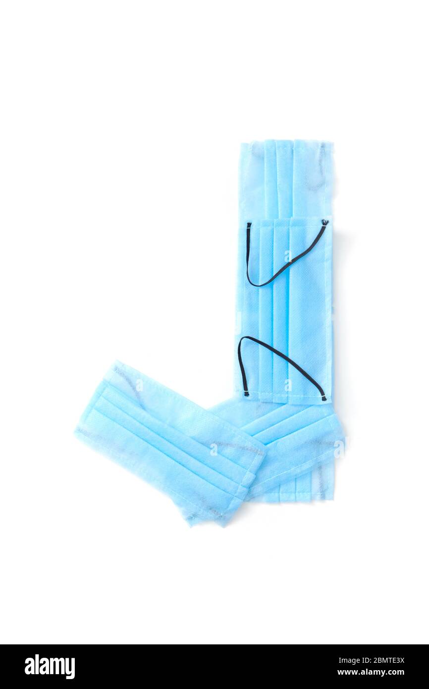 Letter J made from protective medical masks on a white background Stock ...