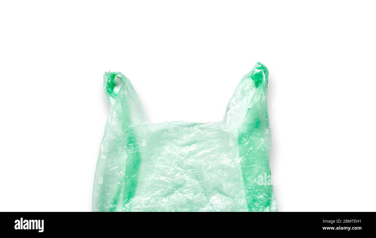 Empty plastic green bag isolated on white Stock Photo - Alamy