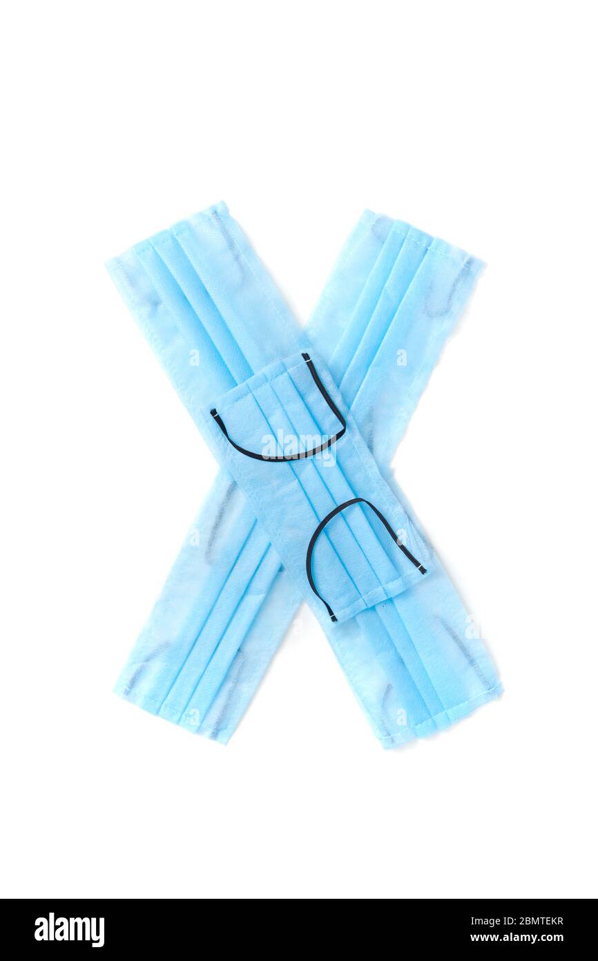 Letter X made from protective medical masks on a white background Stock ...