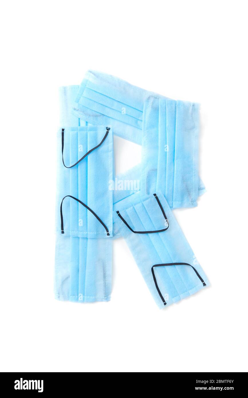 Letter R made from protective medical masks on a white background Stock ...