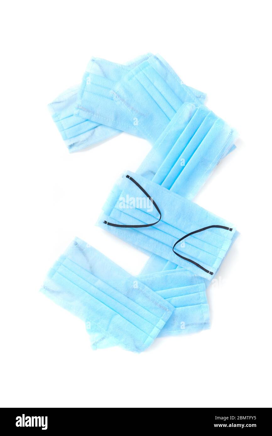 Number three made from protective medical masks on a white background ...