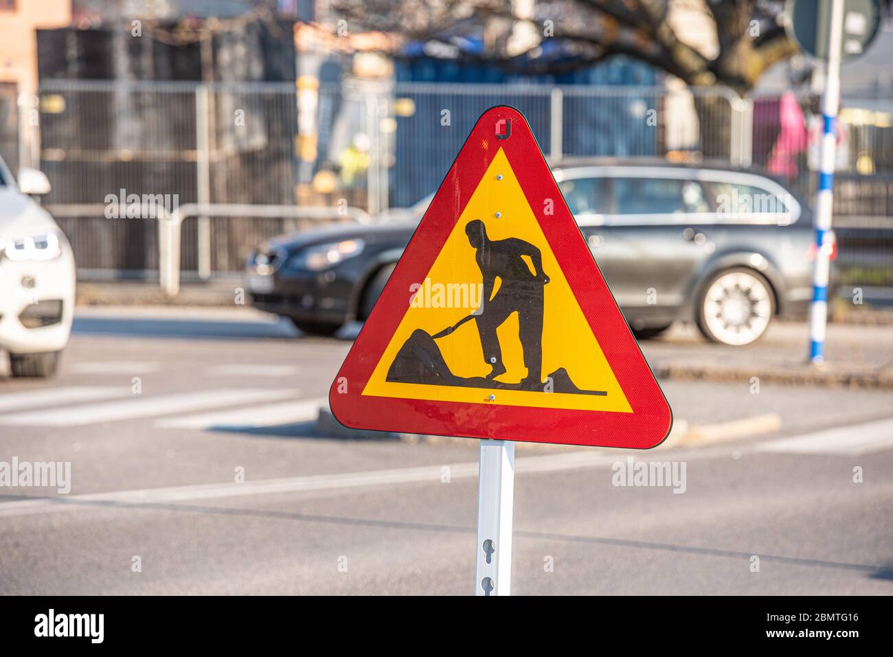 Sign showing roadworks at a crossing Stock Photo - Alamy