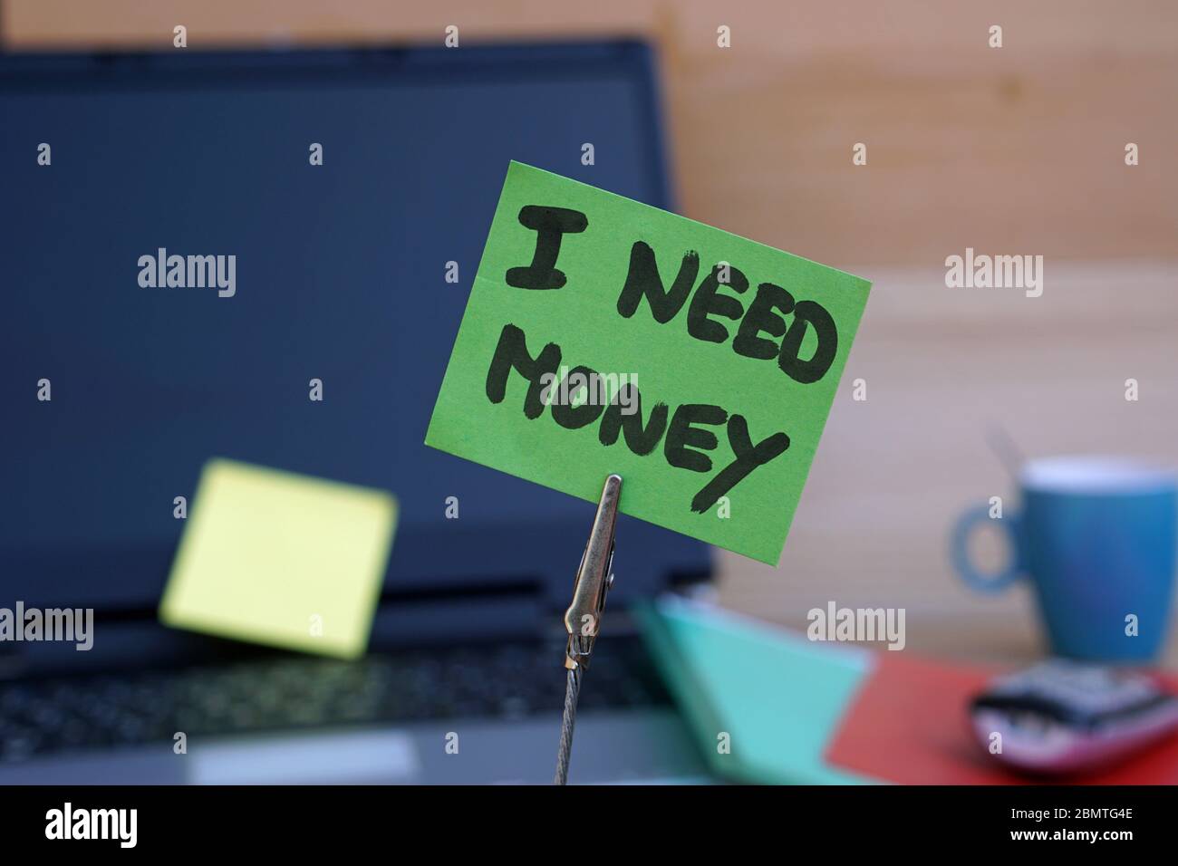 I need money written on a memo at the office Stock Photo - Alamy