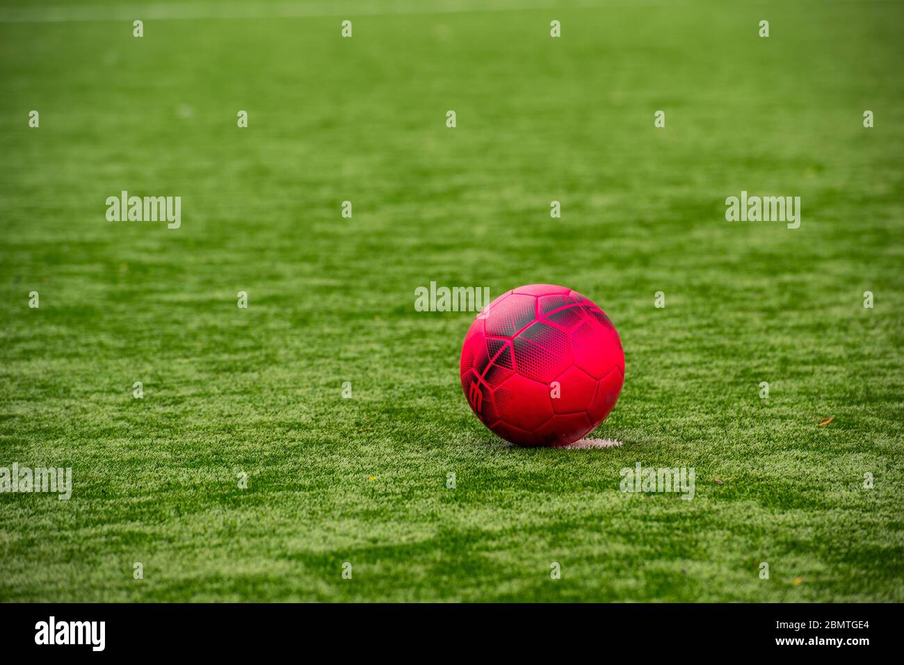 Football on the green hi-res stock photography and images - Alamy