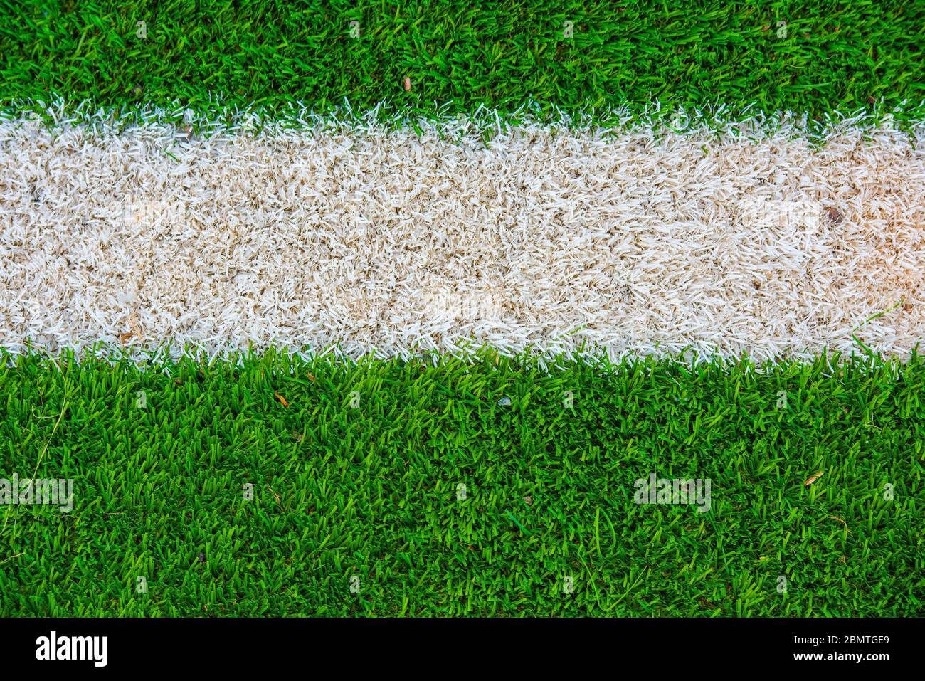 White straight line on artificial turf. From a football field Stock ...