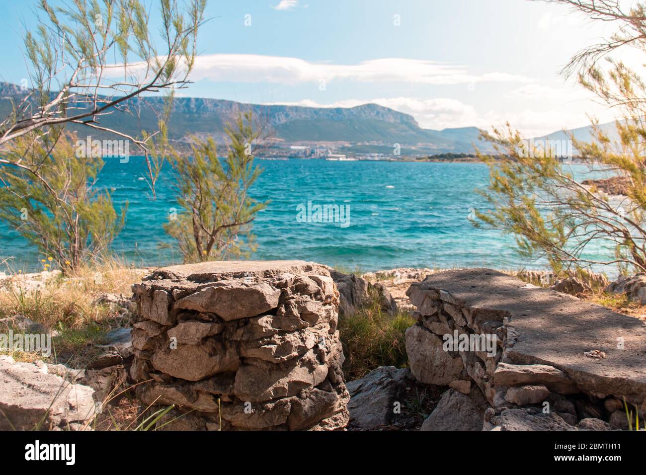 Old stone and chairs made from rocks hidden in a small cove in split ...