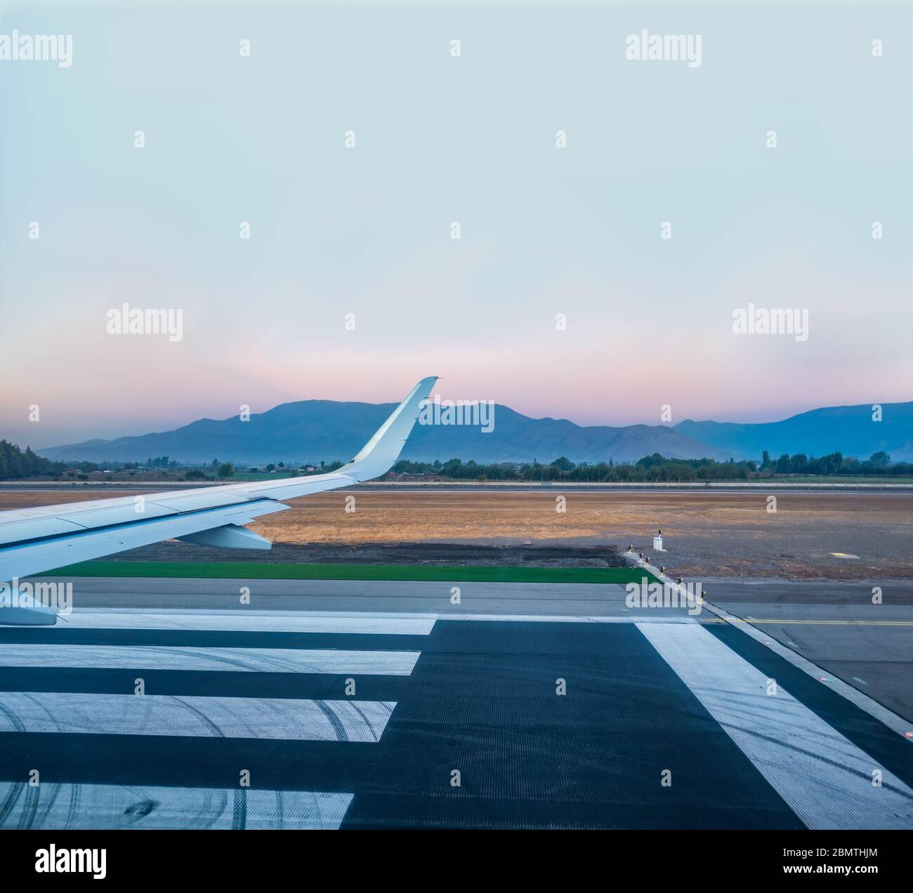 Jet wing prepared for takeoff on runway Stock Photo - Alamy