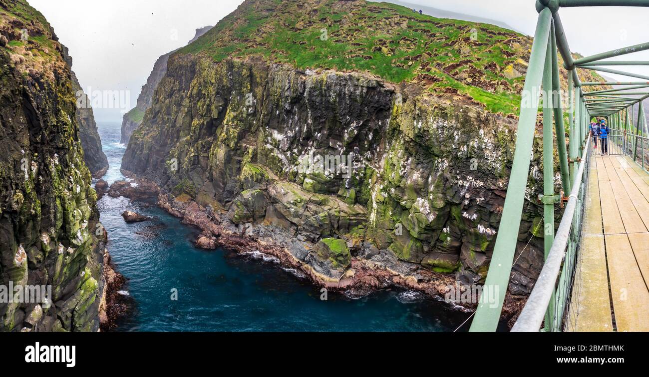 Mykines bridge between two islets in Faroe Islands Stock Photo - Alamy