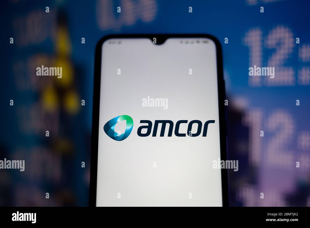 In this photo illustration the Amcor logo seen displayed on a ...