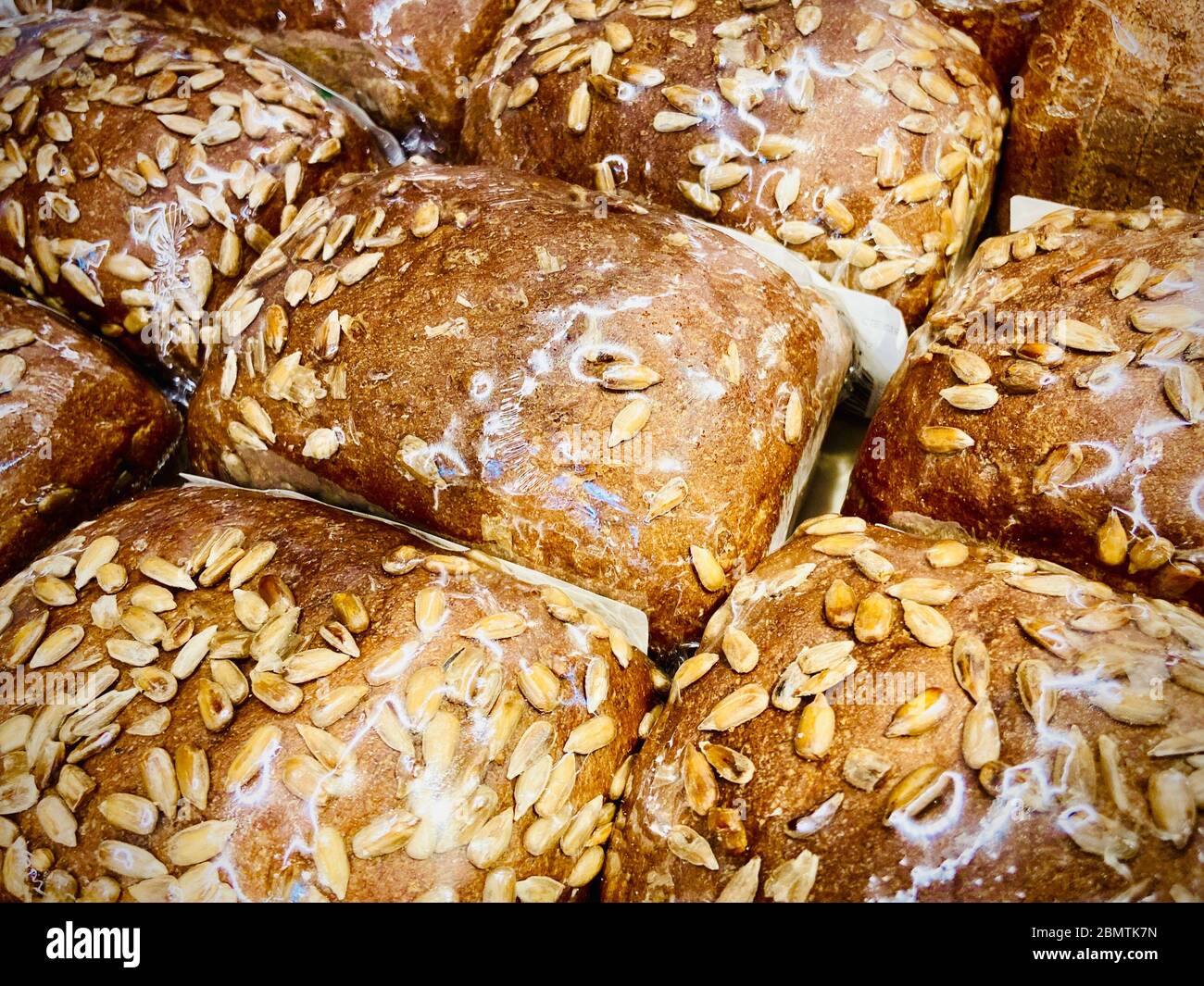 Fresh bread, rolls, cookies and other pastries. A close-up. Supermarket ...
