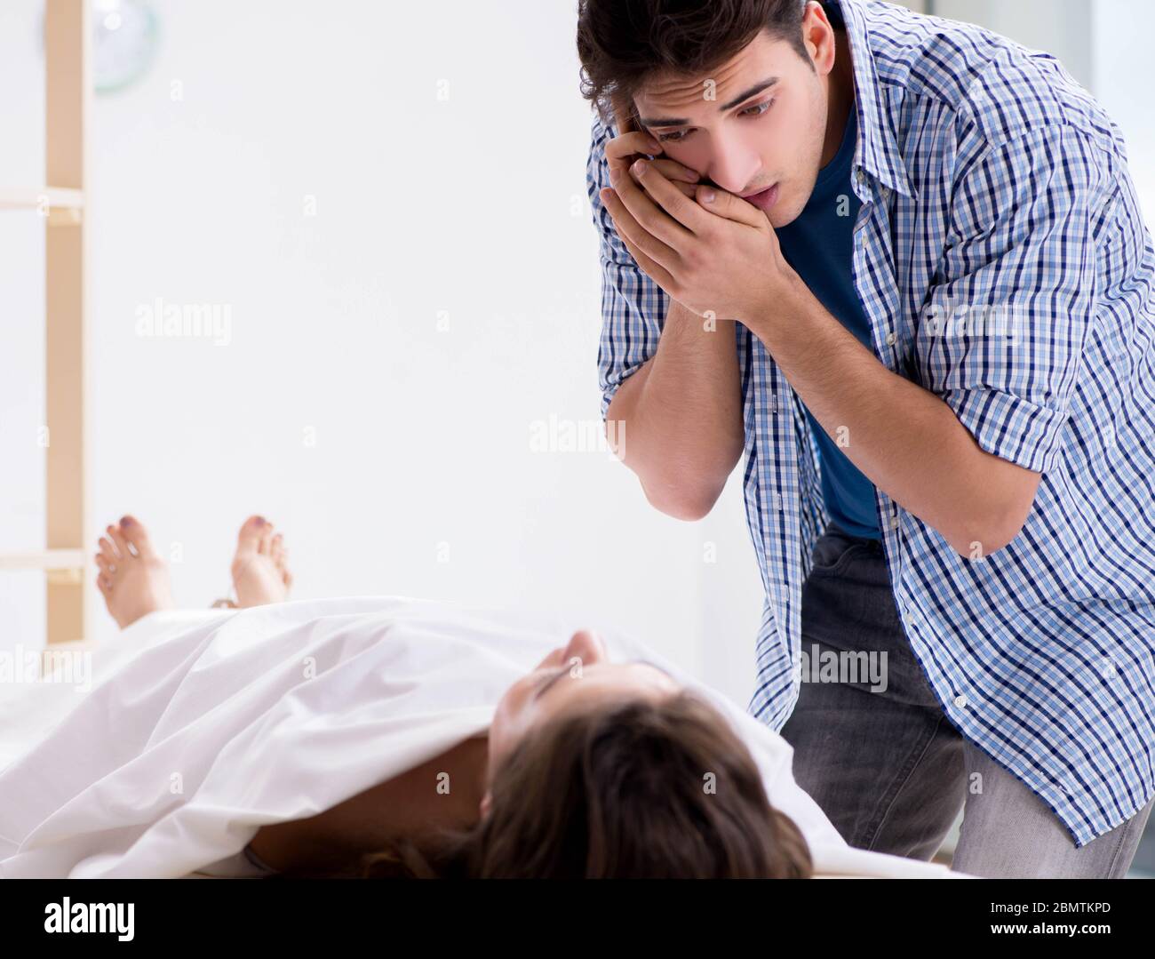 The man mourning his dead wife Stock Photo - Alamy