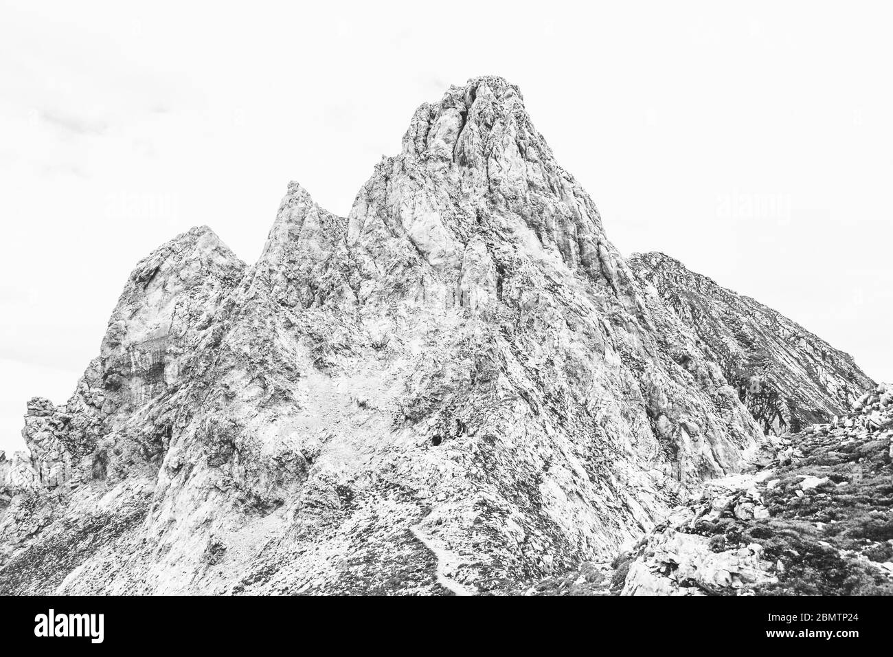 Stone rock in snow Black and White Stock Photos & Images - Alamy