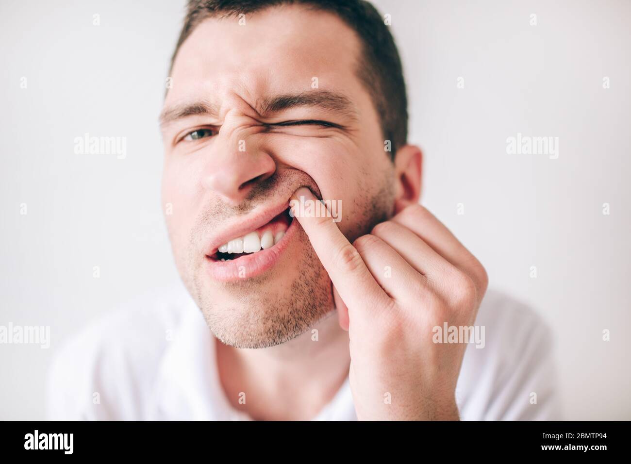 Man finger over lip hi-res stock photography and images - Alamy