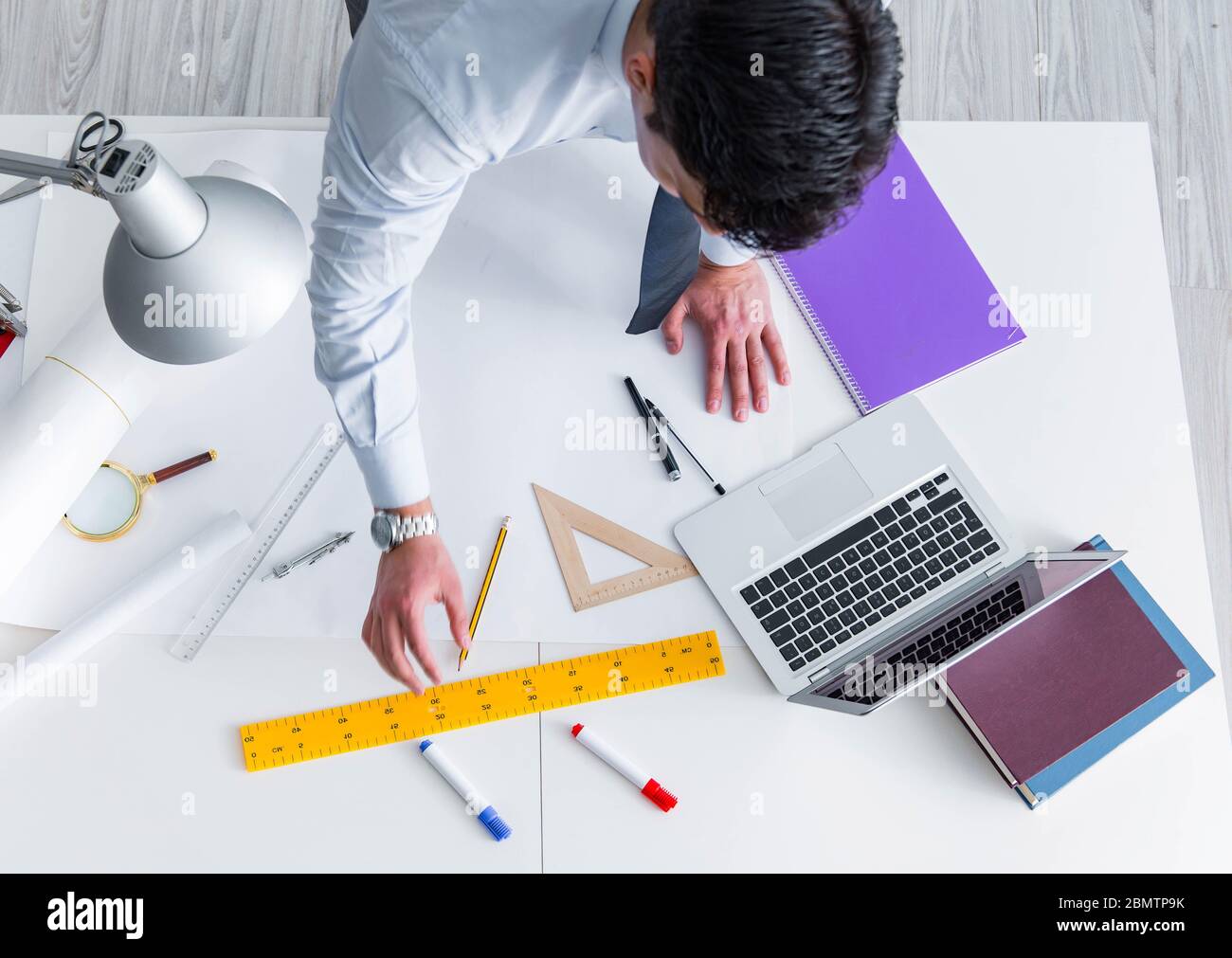 The engineer working on new project drawings Stock Photo - Alamy