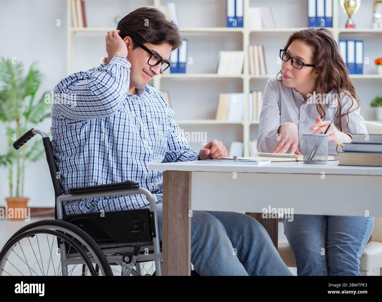The disabled student studying and preparing for college exams Stock ...