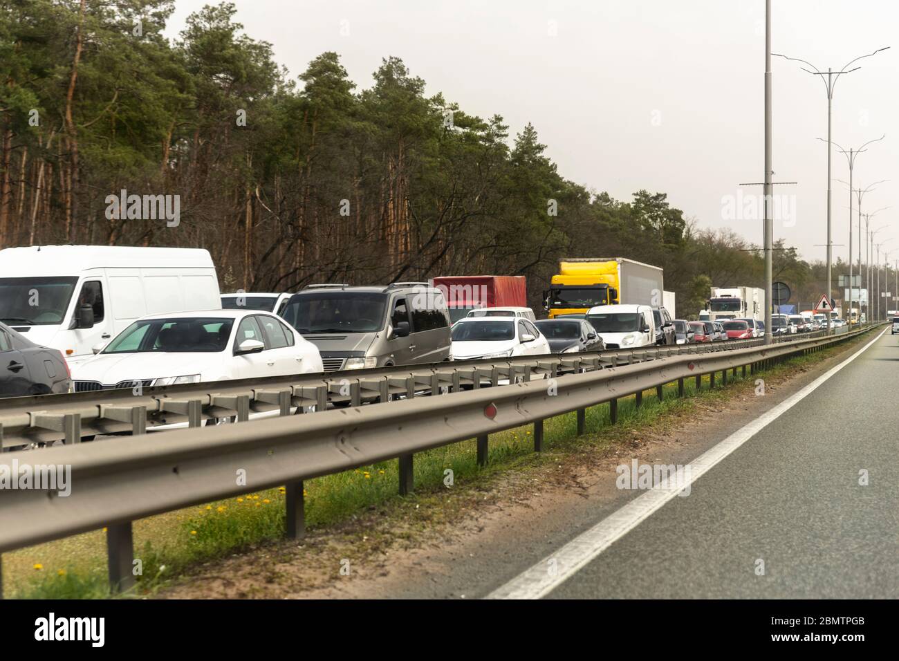 Highway interstate road with car traffic jam and tree forest on ...