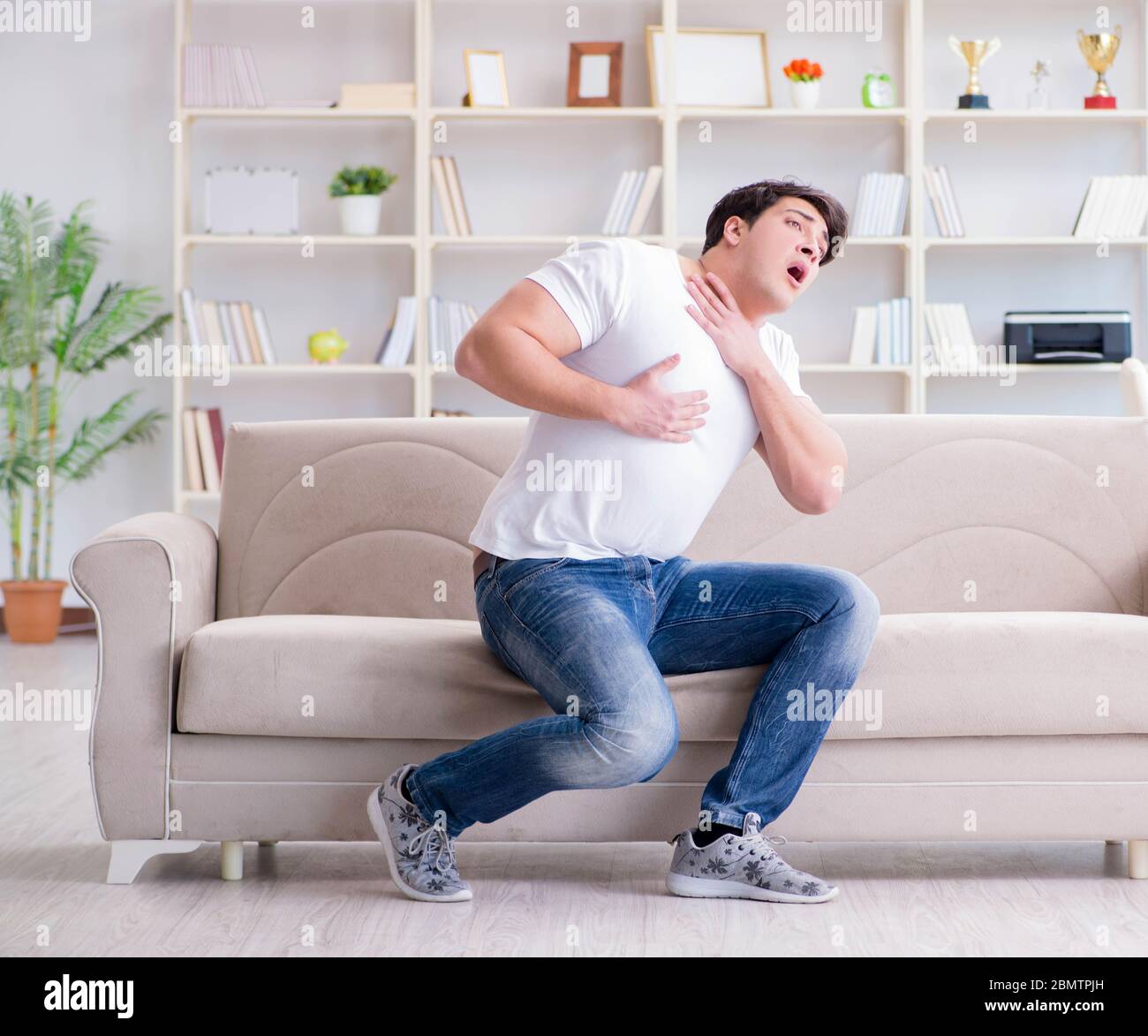 The sick man suffering at home from infection and bad stomach Stock ...