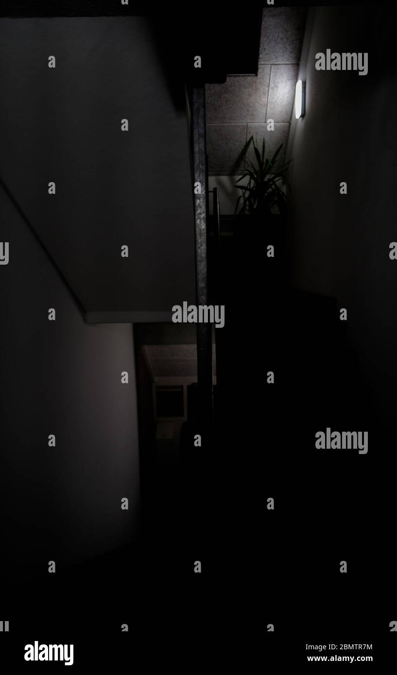 Creepy hallway with very dim lighting Stock Photo - Alamy