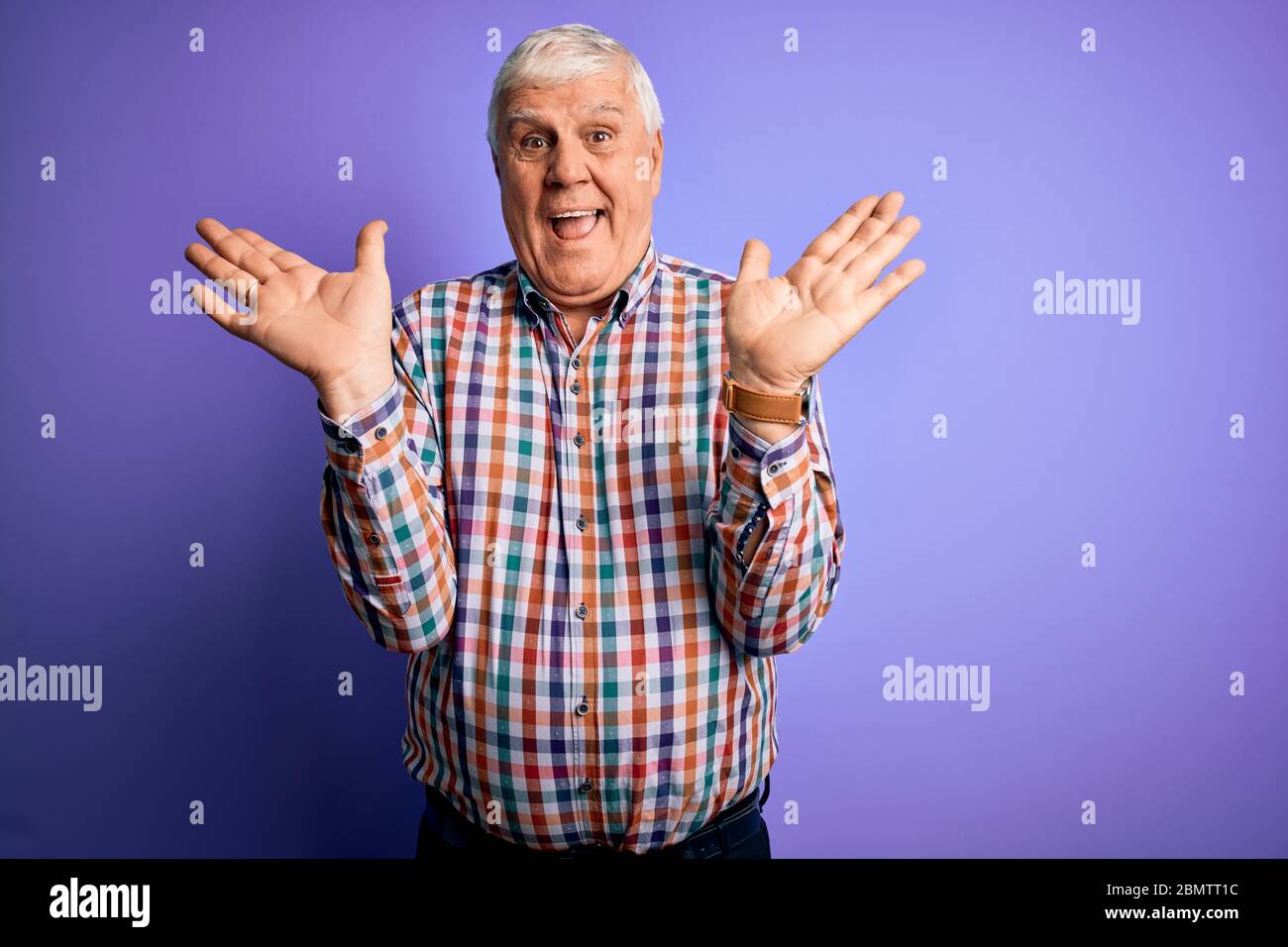 Senior handsome hoary man wearing casual colorful shirt over isolated ...