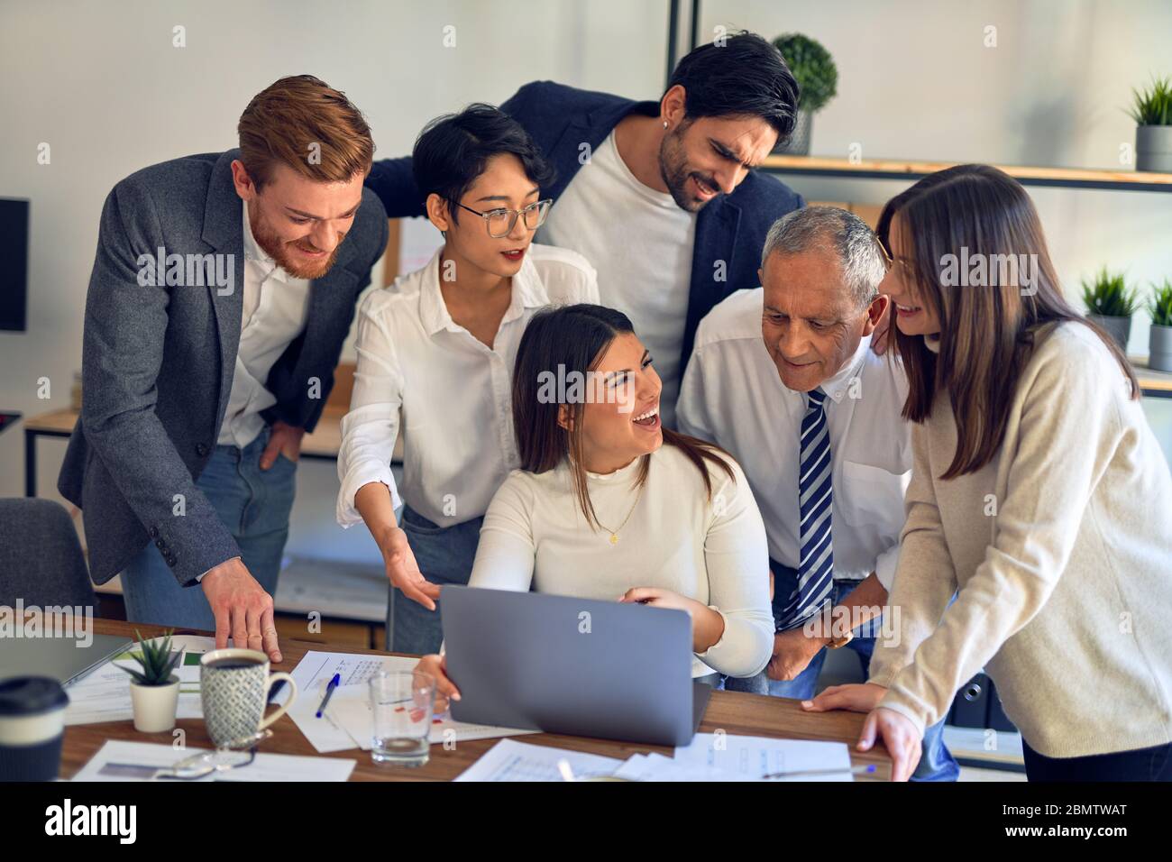 Group of business workers smiling happy and confident. One of them ...