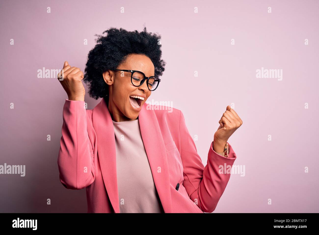 Young beautiful African American afro businesswoman with curly hair ...