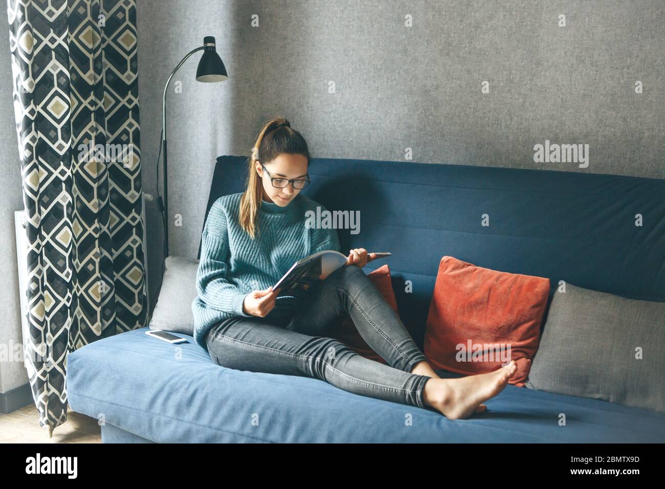 Girl Reading Magazine Teenager High Resolution Stock Photography and ...