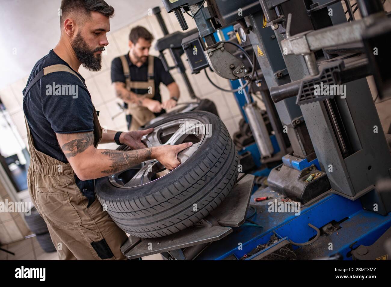 Mechanic in car service.Auto mechanic working in garage Stock Photo - Alamy