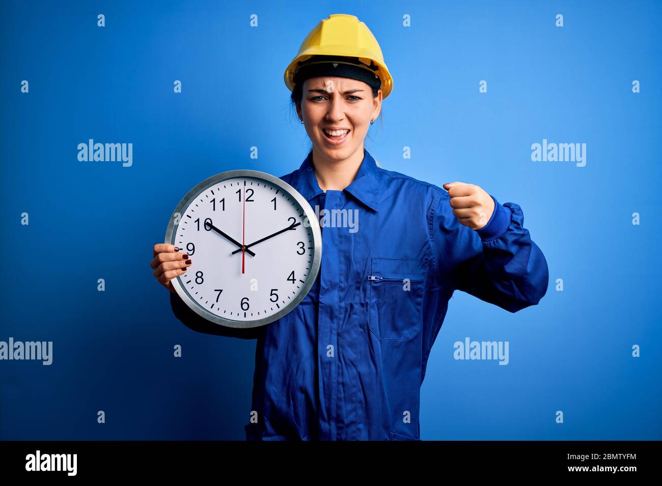 Woman construction worker clock hi-res stock photography and images - Alamy