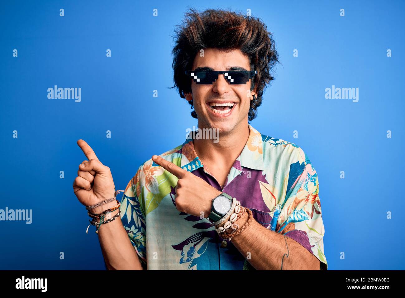 Young handsome man wearing thug life glasses standing over isolated ...