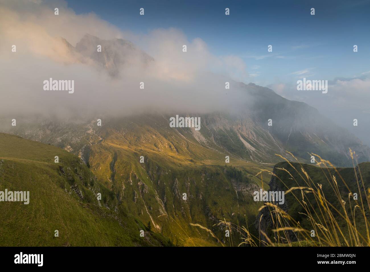 View of landscape and clouds from Marmolada Pass at sunset, South Tyrol ...