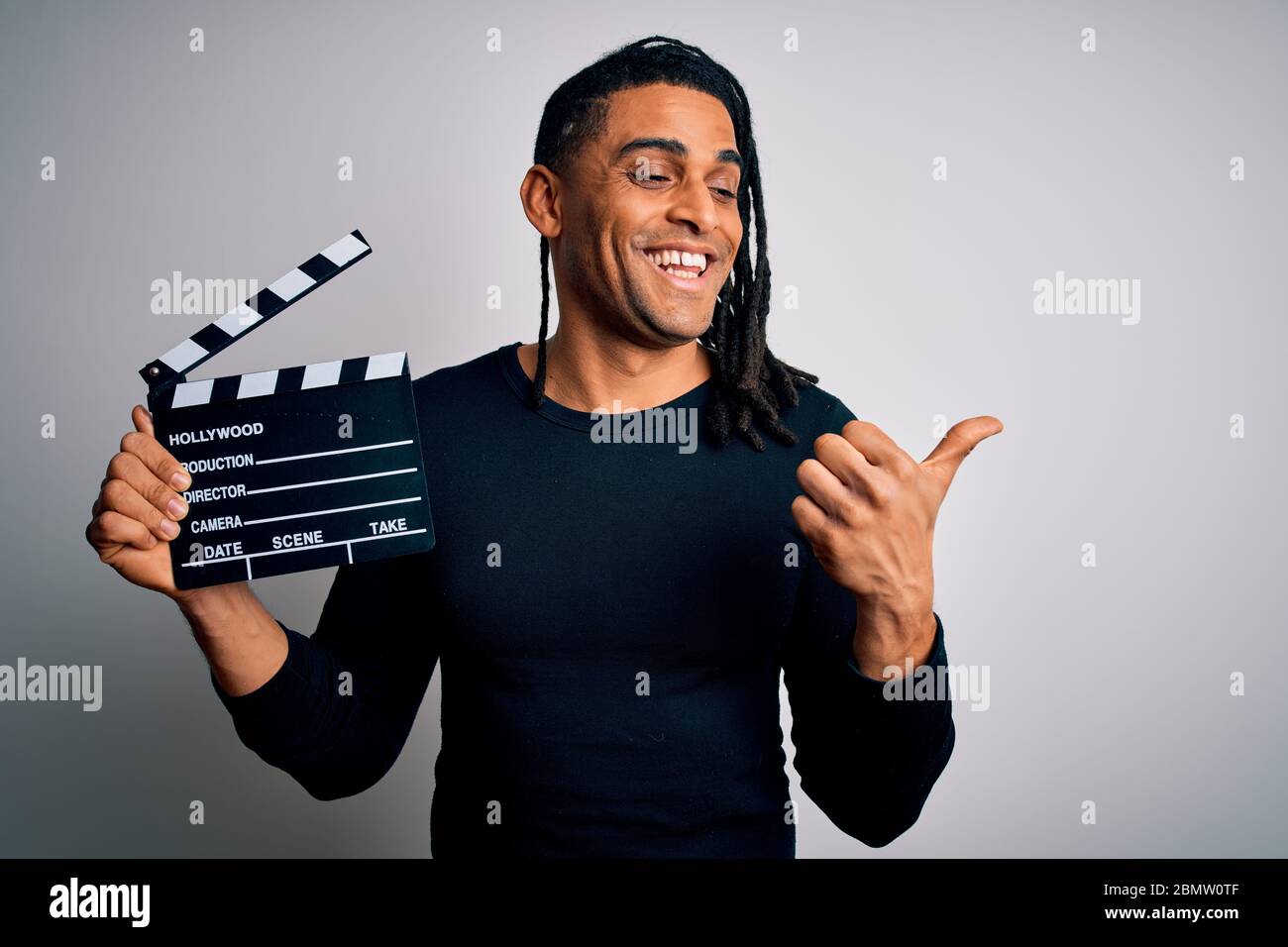 Young african american afro director man making movie using clapboard ...