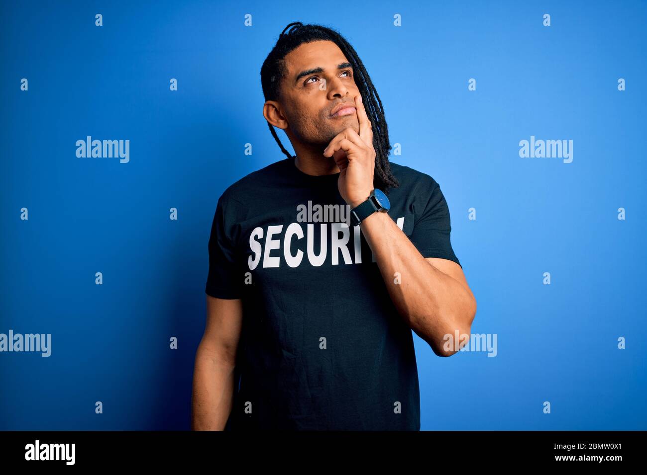 Young african american afro safeguard man with dreadlocks wearing ...
