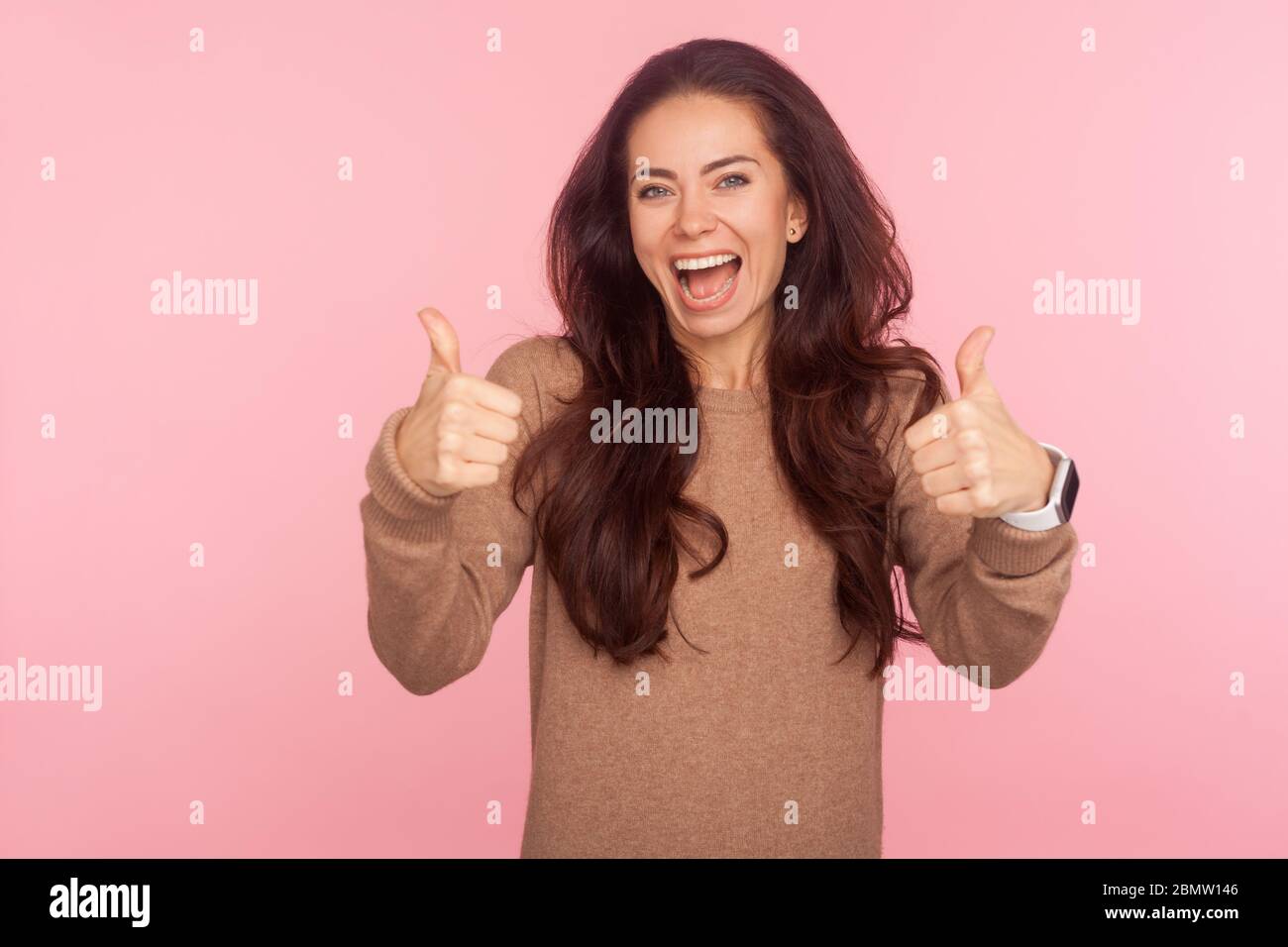 Excellent job, well done! Portrait of joyful awesome young woman with ...