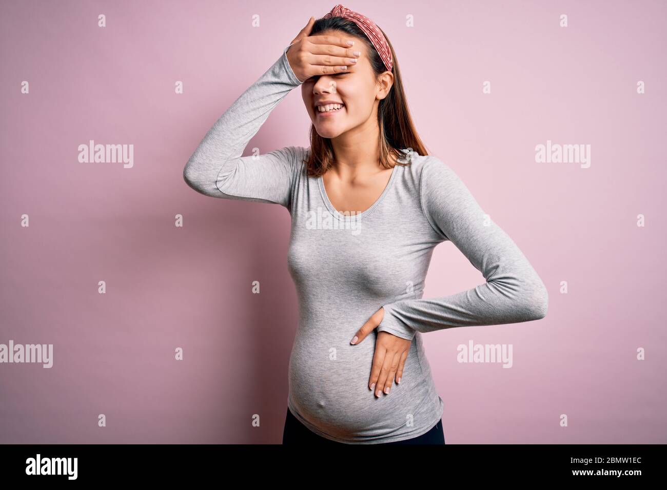 Young beautiful teenager girl pregnant expecting baby over isolated ...