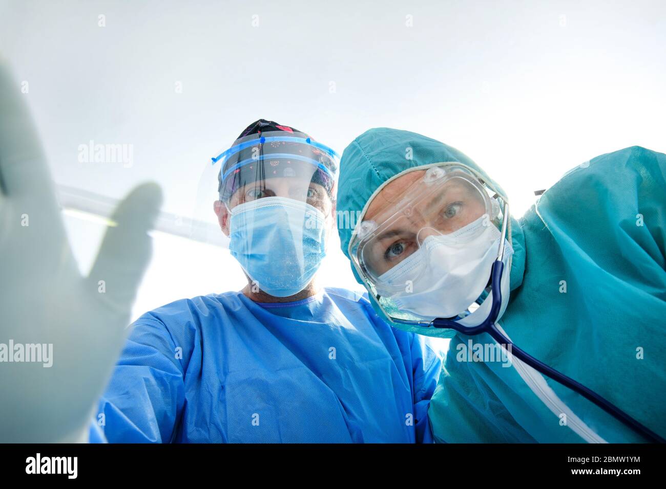 Giving first medical help in hospital. Doctors give resuscitation to ...