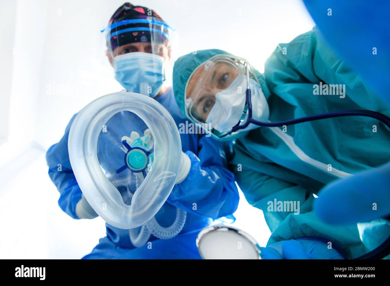 Giving first medical help in hospital. Doctors give resuscitation to ...