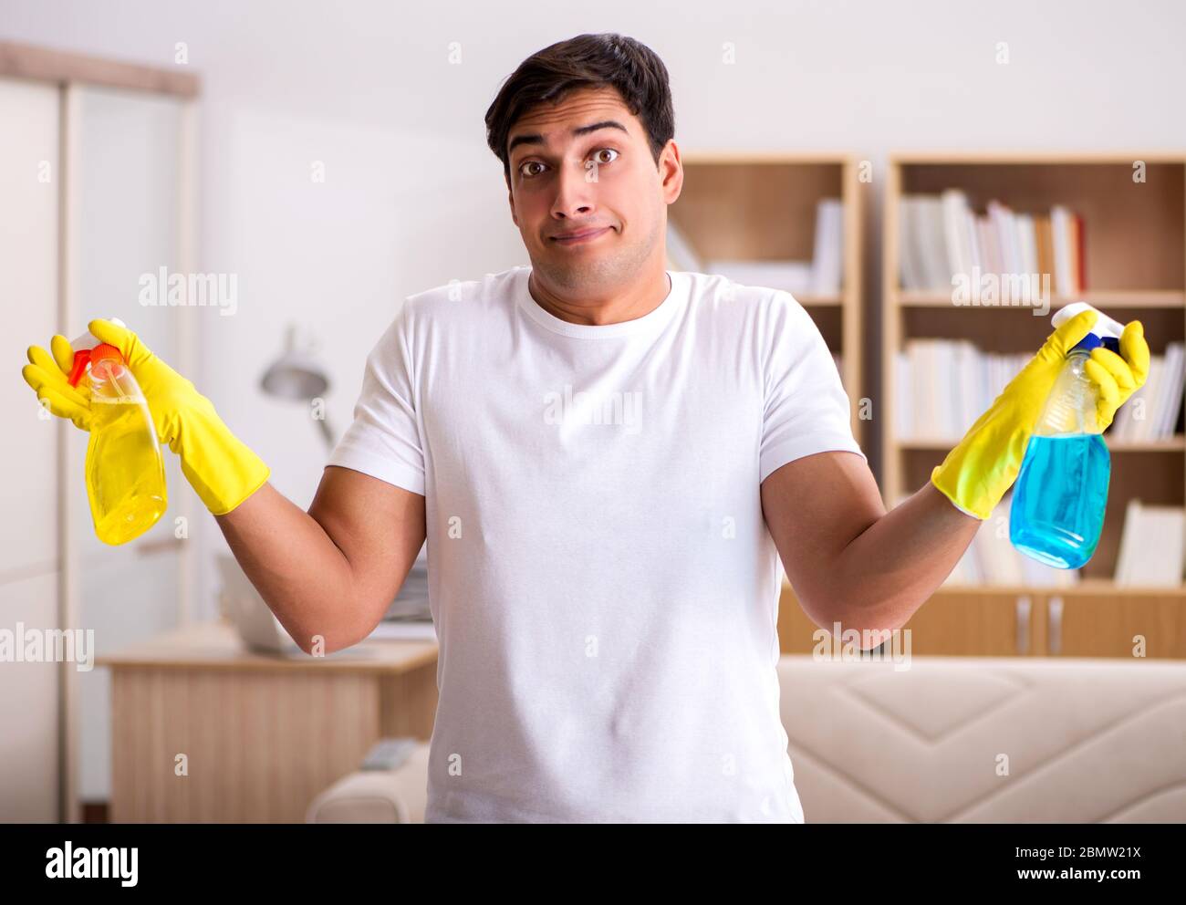 The man husband cleaning the house helping wife Stock Photo - Alamy