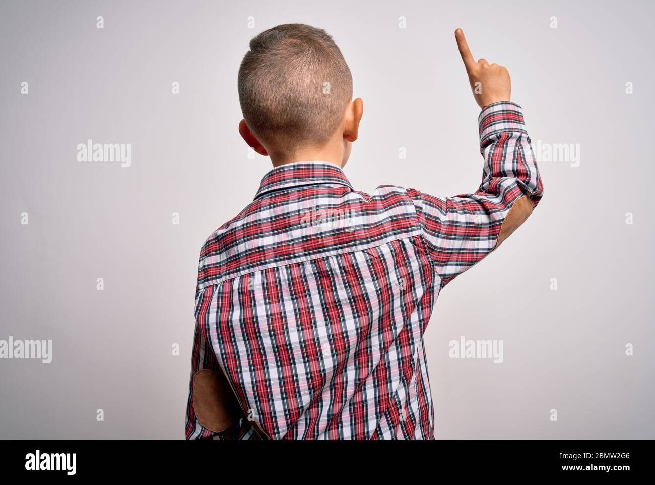 Young little caucasian kid with blue eyes wearing elegant shirt ...