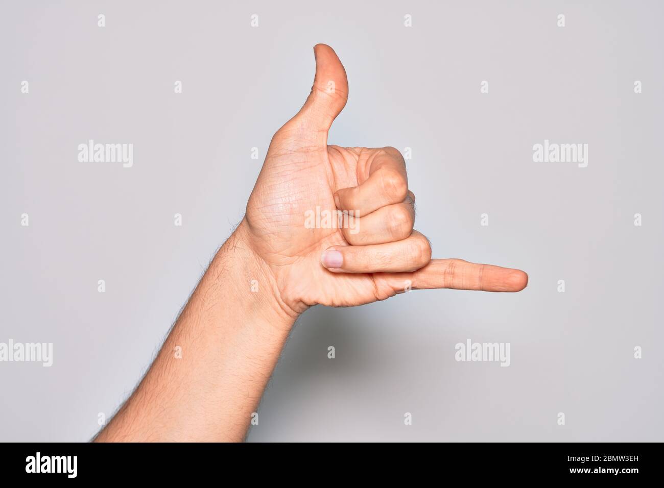 Hand of caucasian young man showing fingers over isolated white ...