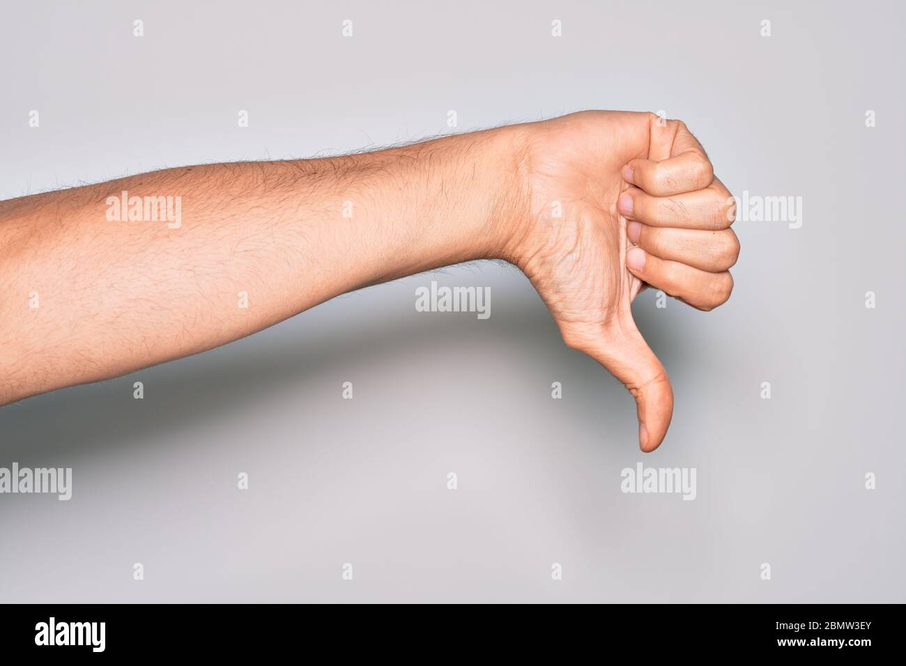 Hand of caucasian young man showing fingers over isolated white ...