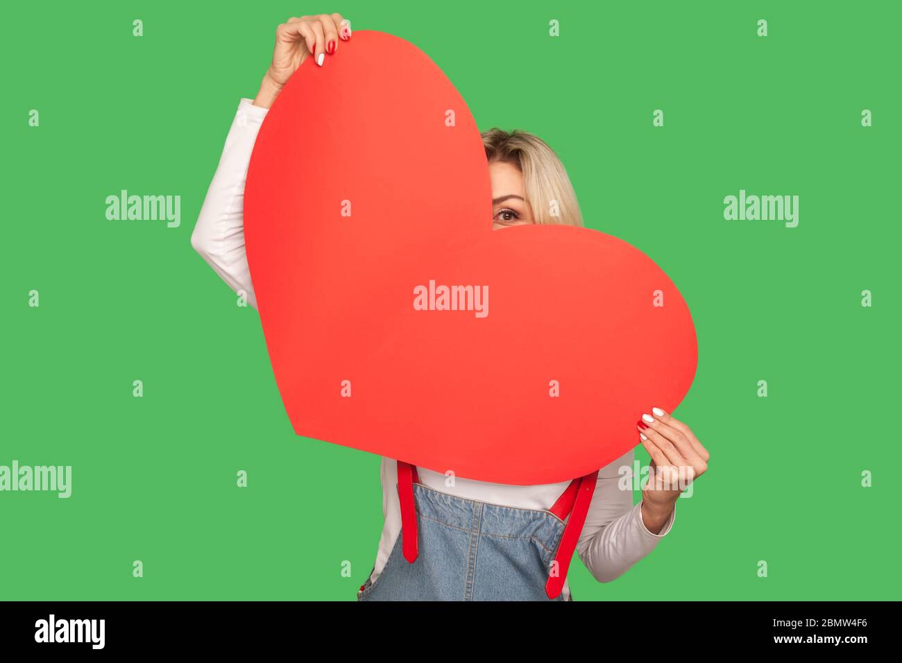 Romantic feelings. Portrait of playful positive woman shy of confessing ...