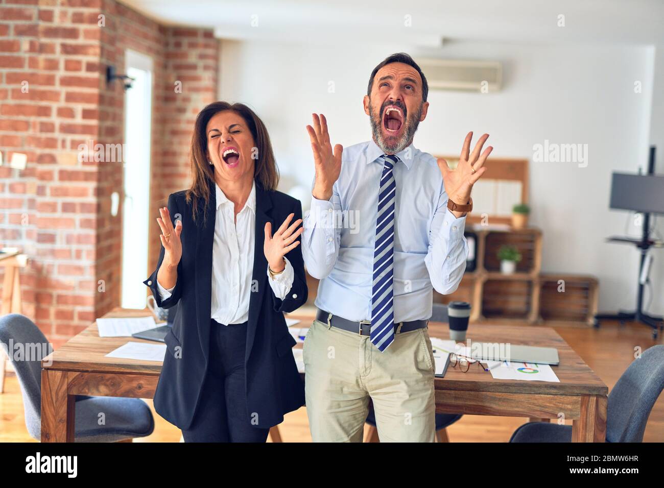 Angry woman yelling business man desk hi-res stock photography and ...
