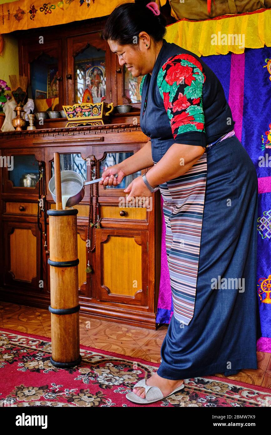 Nepal, Kathmandu valley, sherpa woman making traditional tibetan tea ...