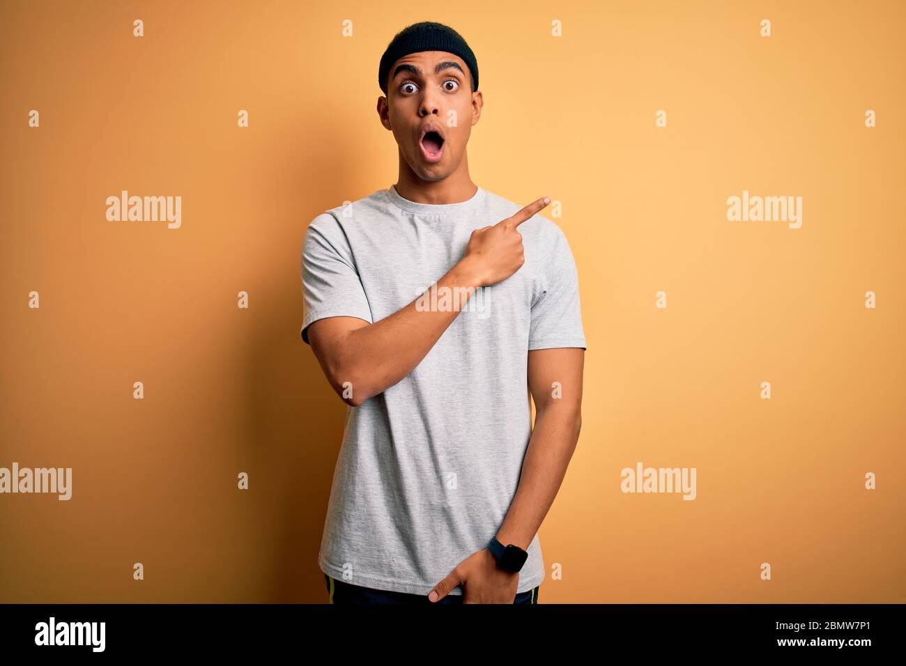 Handsome african american sportsman doing sport wearing sportswear over ...