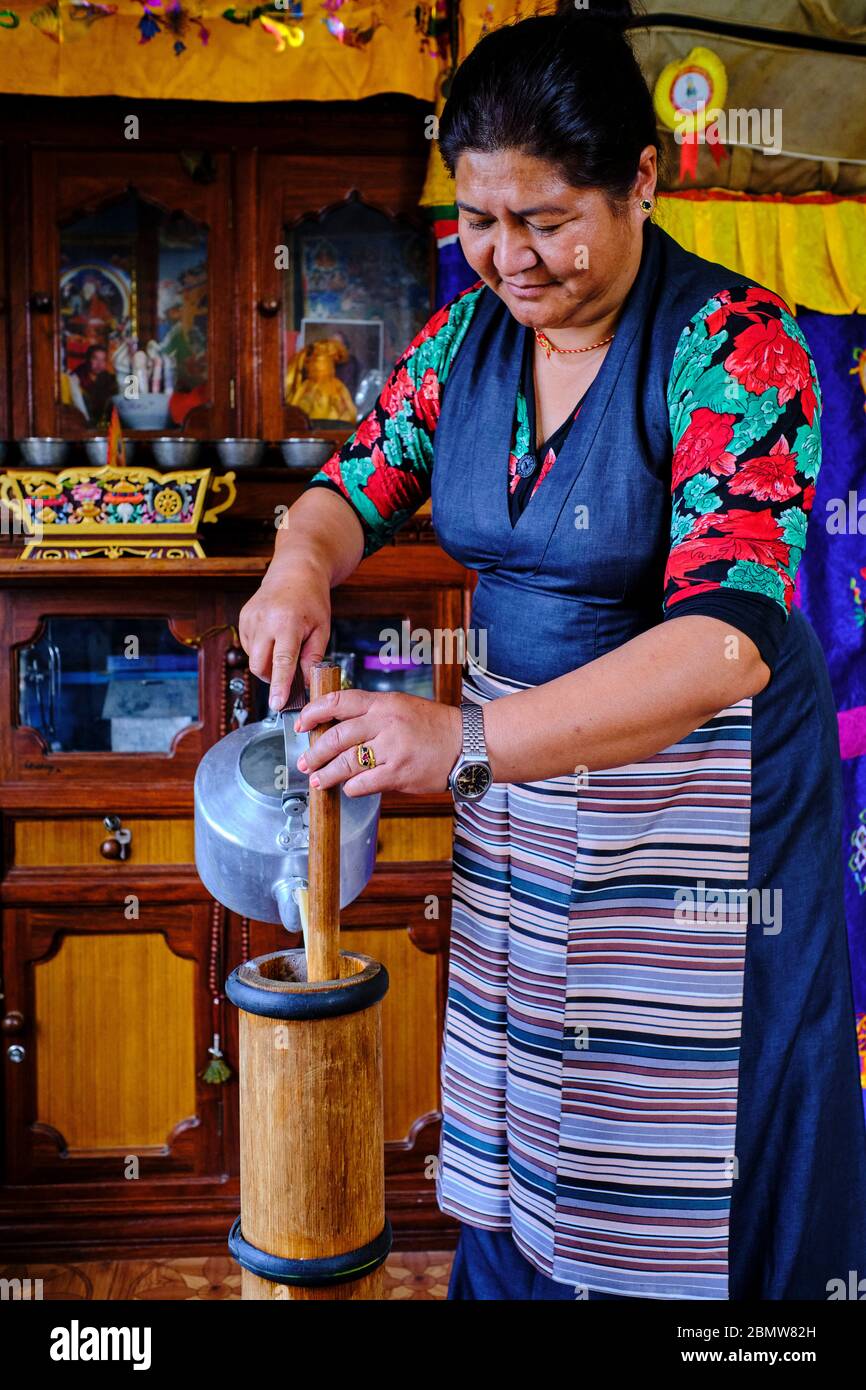 Nepal, Kathmandu valley, sherpa woman making traditional tibetan tea ...