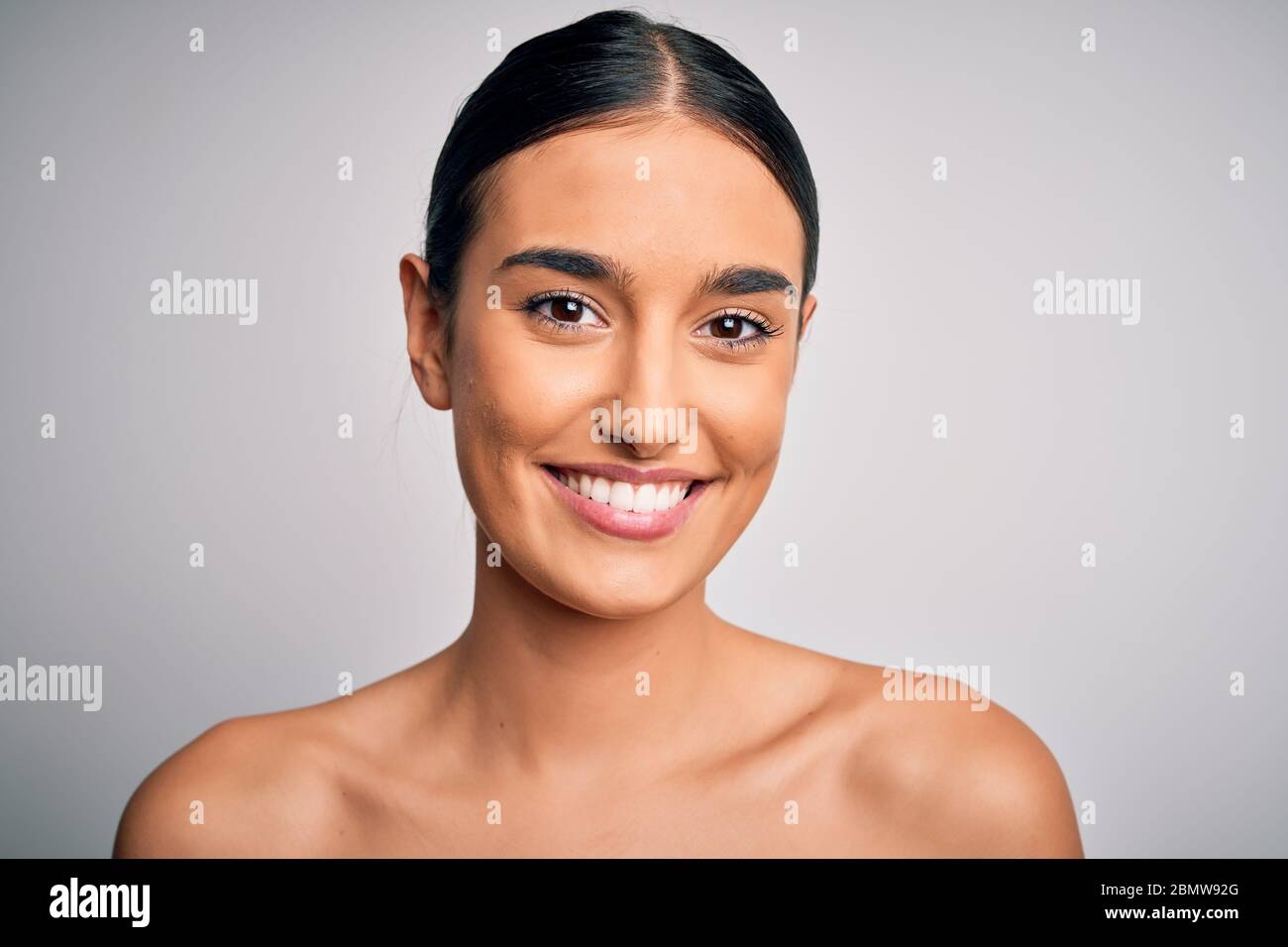 Close up of young beautiful woman with clear and pure skin. Perfect and ...