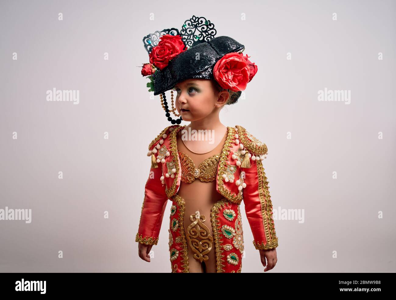 Young little caucasian kid girl wearing bullfighter traditional folkore ...