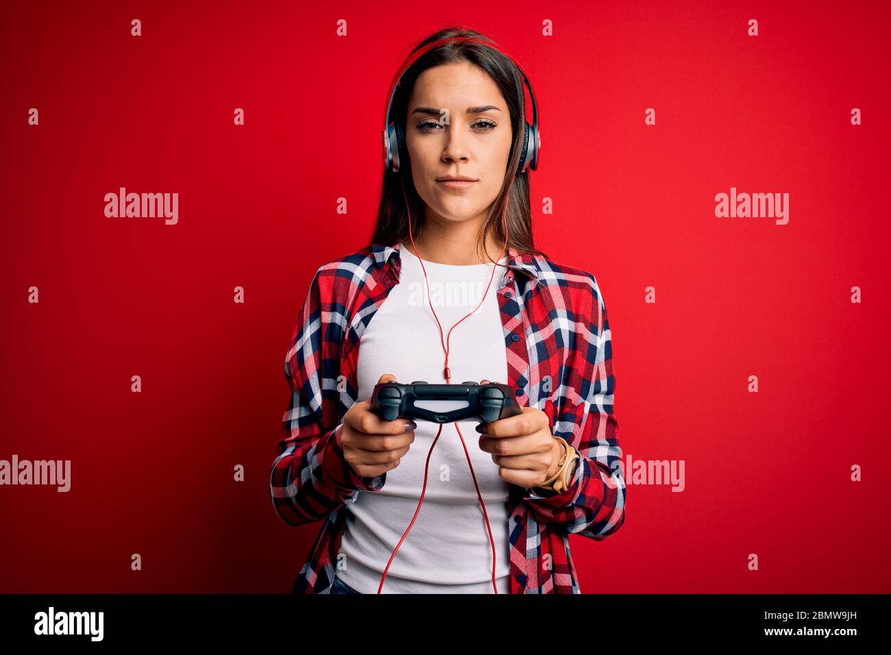 Beautiful brunette gamer headphones on hi-res stock photography and ...