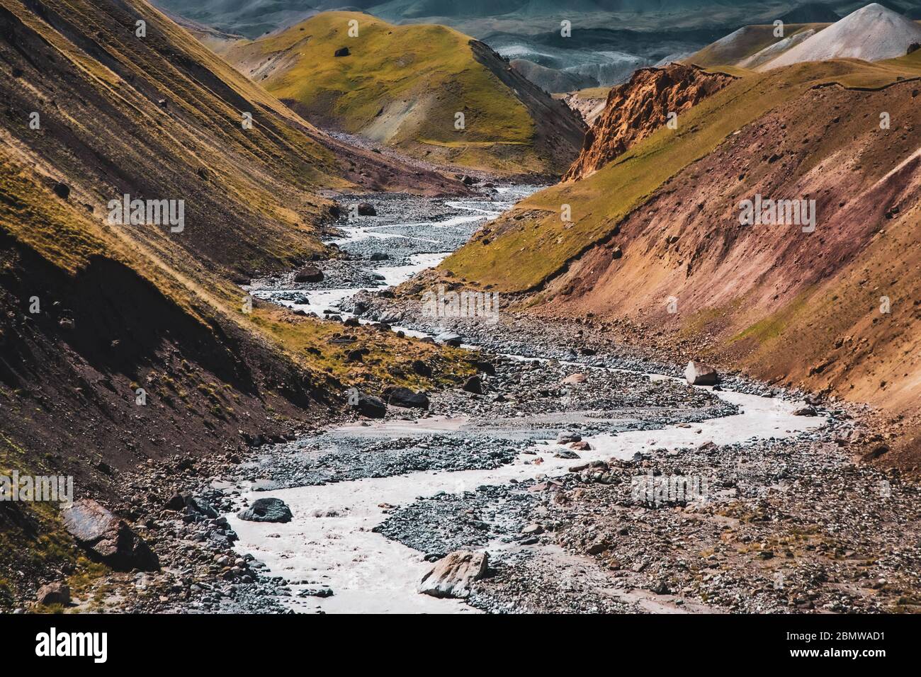 Scenic landscape of the sandy gorge between hills. Mountainious terrain ...